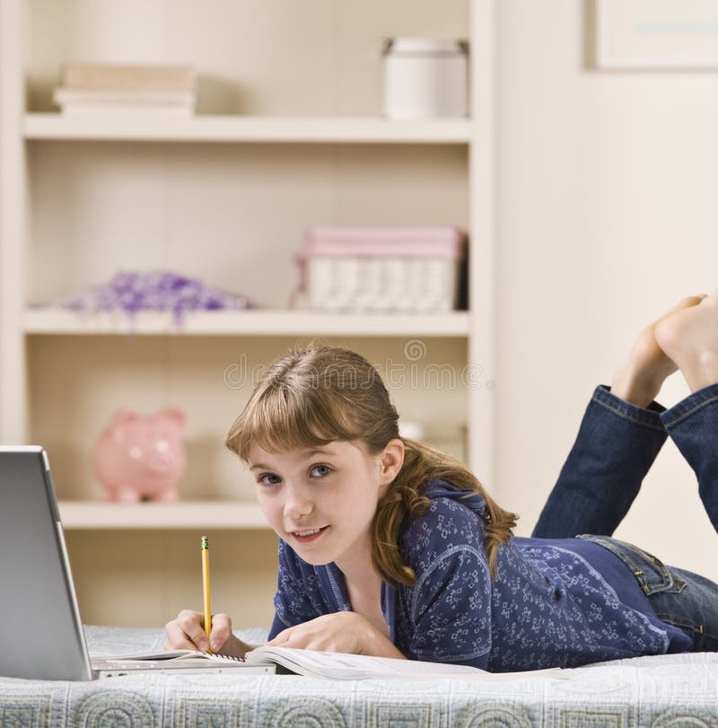 Girl Working on Homework stock image. Image of work, blue - 10196389