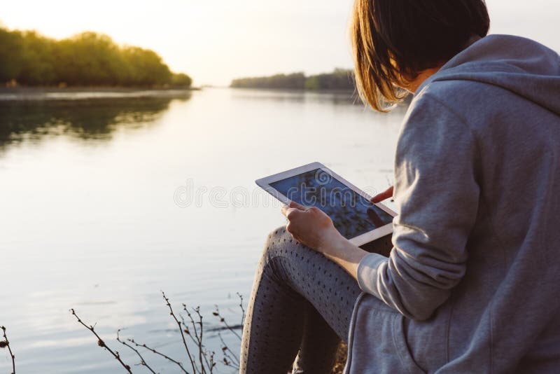 Girl Working with Tablet at the River Stock Photo - Image of relax ...