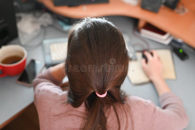 Girl Works Behind Computer Monitors. Background. Remote Work. Freelance ...
