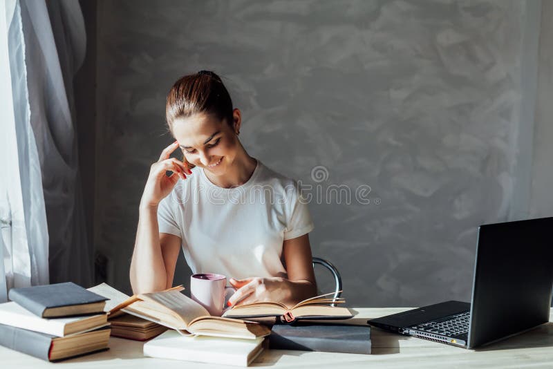 Girl Works at the Computer Reads Books Stock Image - Image of computer ...