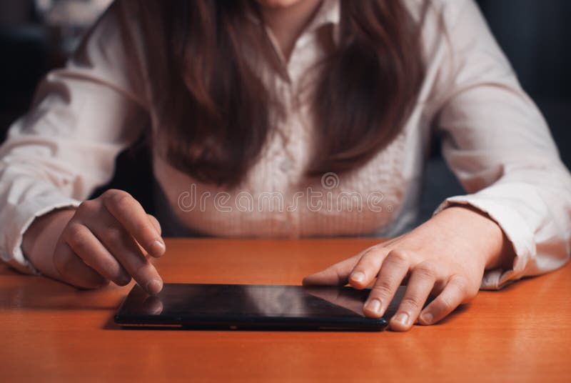 Girl works on the tablet stock photo. Image of desk, black - 68759576