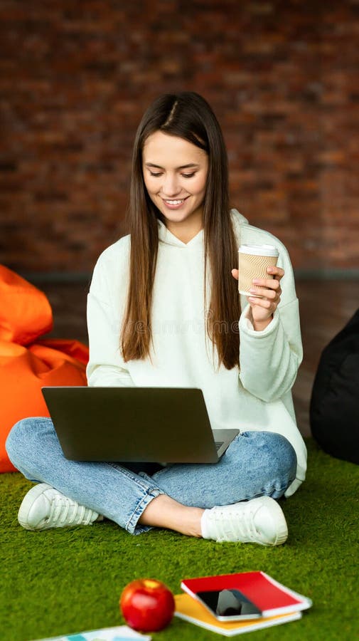 Girl in Workspace Working on Laptop and Drinking Coffee Stock Image ...