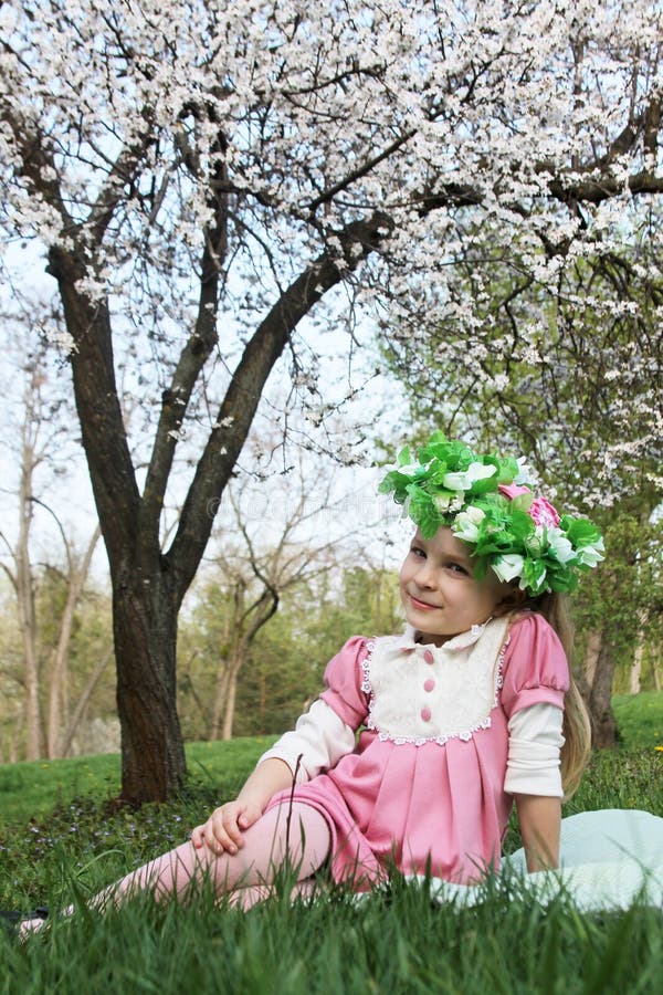 Girl in Wreath Sitting Under Spring Tree Stock Image - Image of holding ...