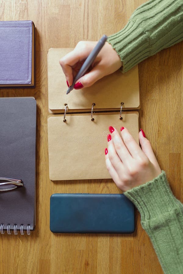 Girl Writes Down a Summary of the Training Session in a Notebook. Stock ...