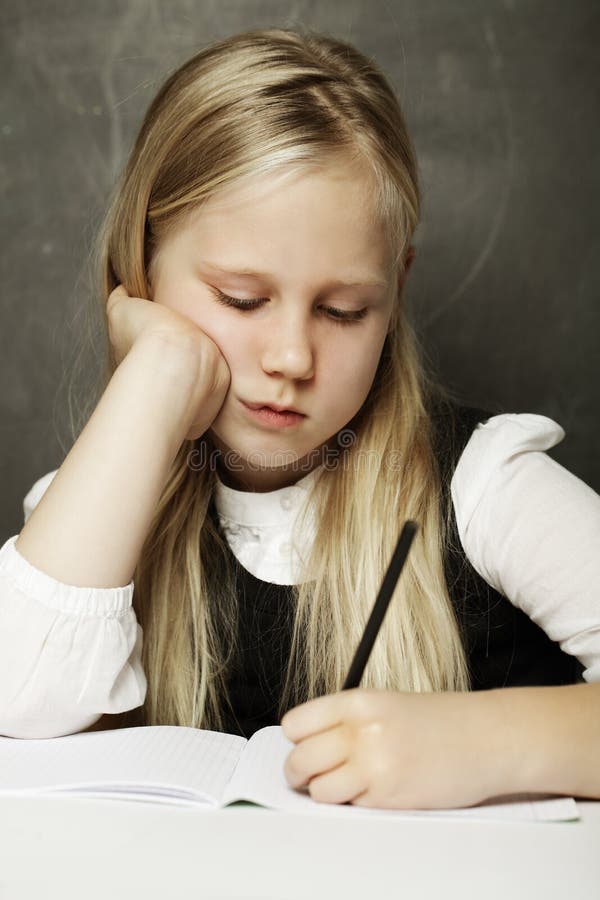 Girl Writing in Classroom - Examination Stock Photo - Image of people ...