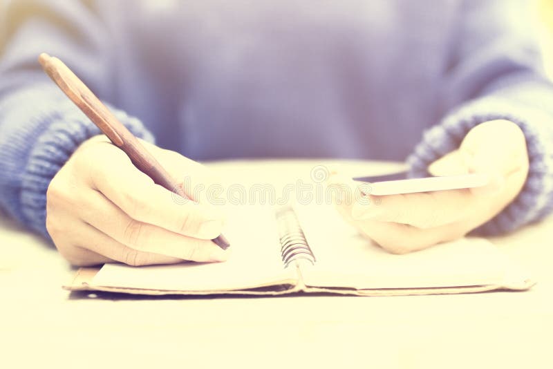 Girl Writing in Diary with Cell Phone Stock Image - Image of hipster ...