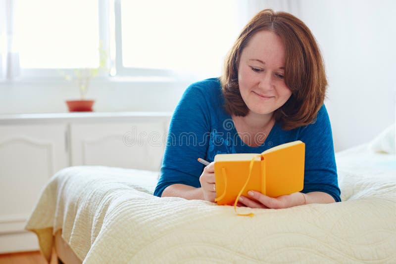 Girl Writing into Diary or Planning Her Day Stock Photo - Image of ...