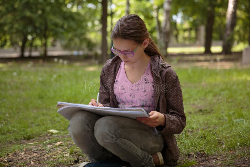 Girl Writing on Her Notebook Stock Image - Image of autumn, little ...