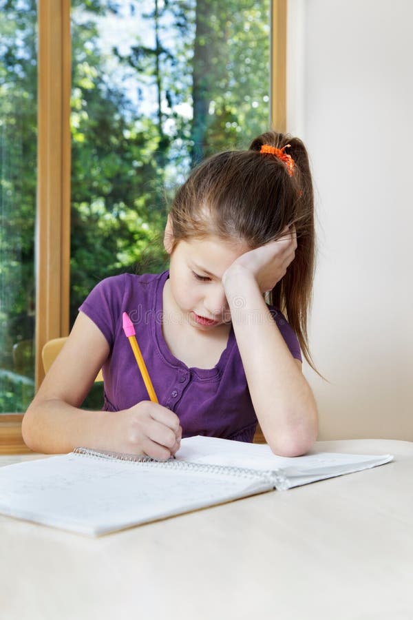 Young girl doing homework stock photo. Image of homework - 21141822