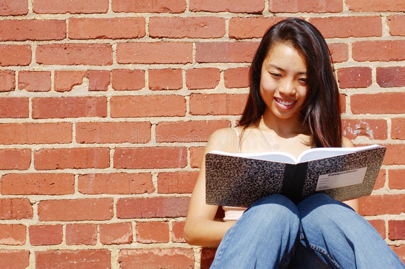 Girl Writing in Note Book stock image. Image of meadow - 6253677