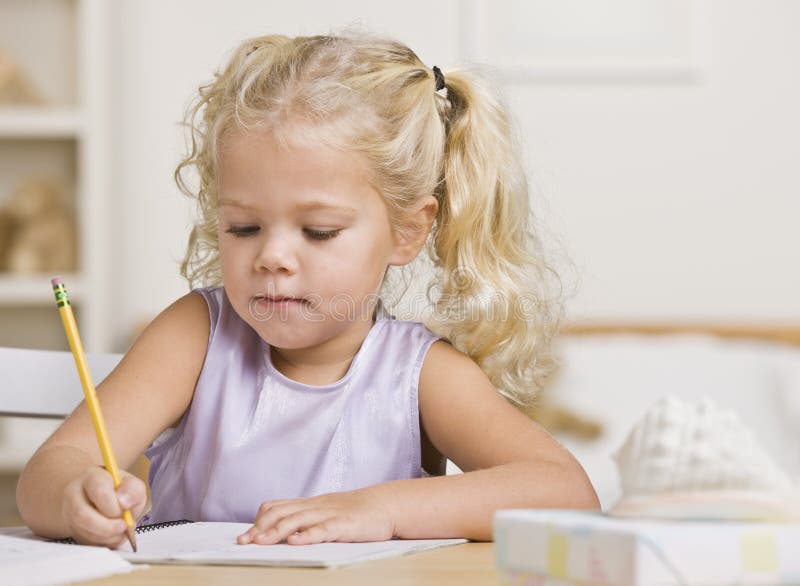 Girl Writing in a Notebook stock photo. Image of girl - 10196480