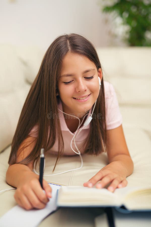Girl Writing in a Notebook Lying on the Bed Stock Image - Image of ...