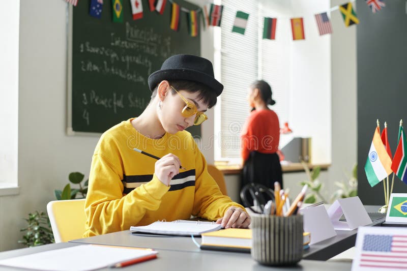 Girl Writing in Notebook in School Stock Photo - Image of rights ...