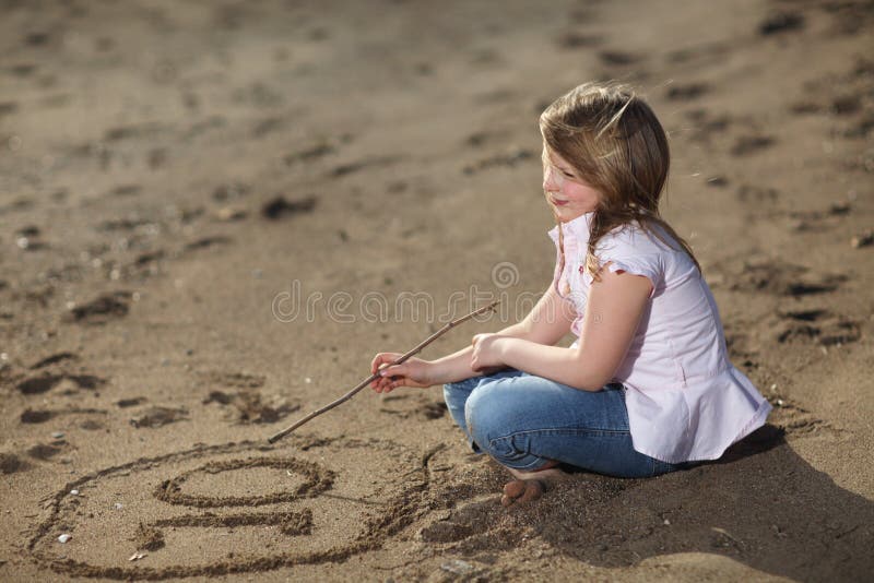Girl Writing Number in the Sand Stock Photo - Image of portrait ...