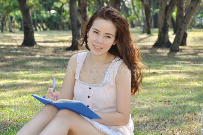Girl is Writing paper note stock photo. Image of lady - 48688368