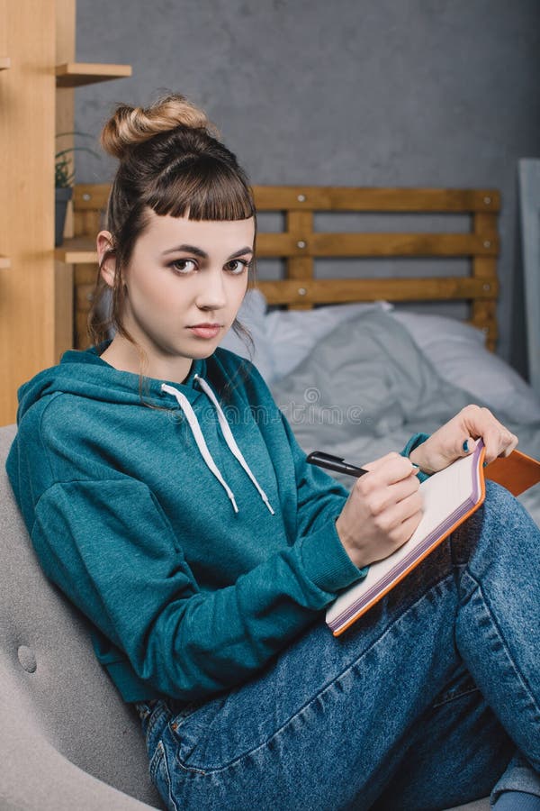 Girl Writing Something To Notebook and Looking Stock Image - Image of ...