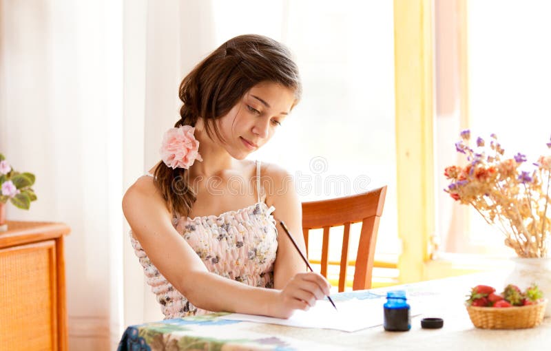 Girl Writing at Table by Pen and Ink Indoor Stock Image - Image of mail ...