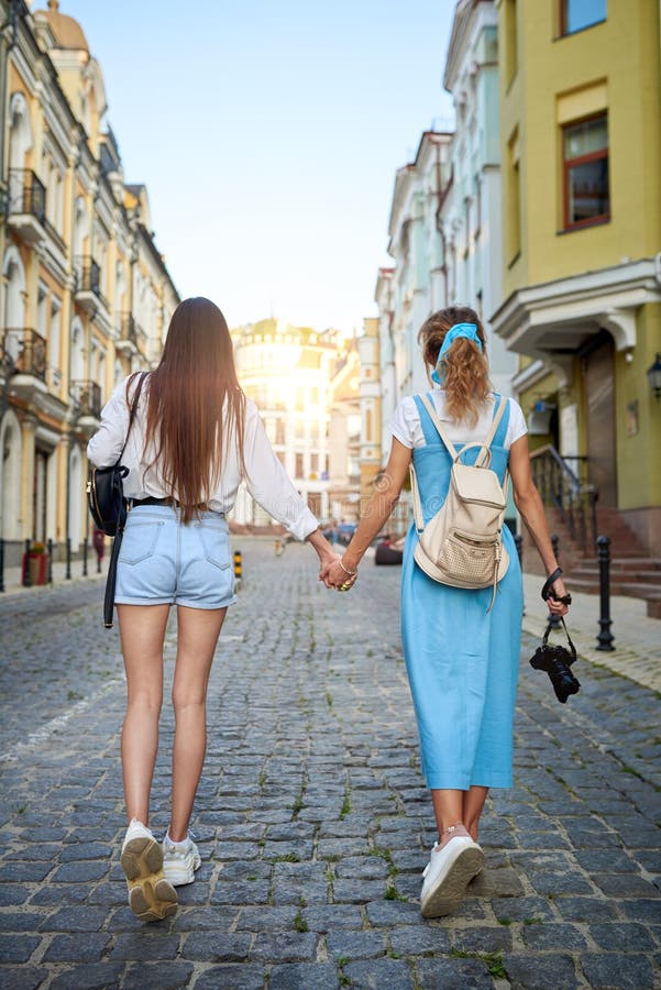 Girlfriends Hold Hands and Walk Around the City Stock Photo - Image of ...