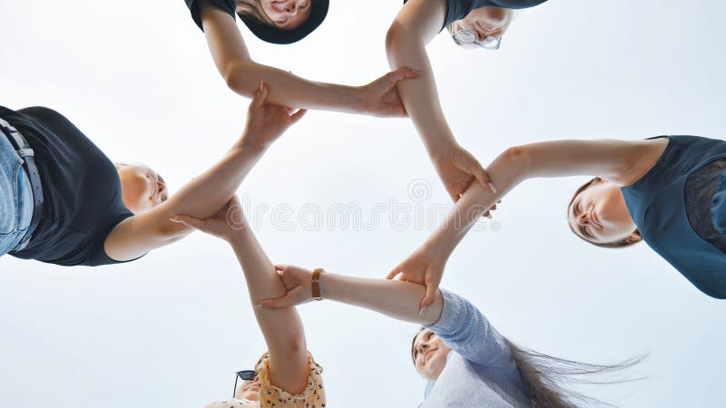 The Girlfriends Join the Wrists in the Center Making a Circle Shape ...