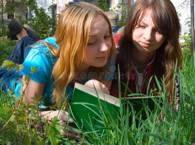 Girlfriends Read Book in the Park. Stock Photo - Image of people ...