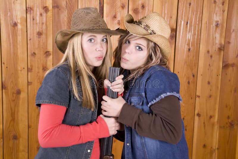 Girls Blowing on Shotgun Barrel Stock Image - Image of blue, farmer ...