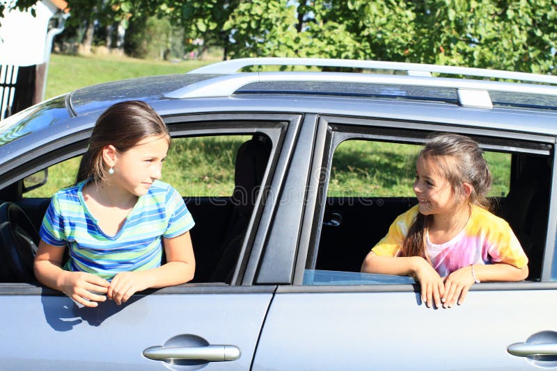 Girls in car windows stock image. Image of children, opened - 33477597