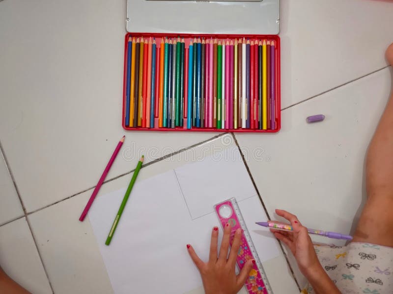 Girls are Drawing and Coloring on White Paper. Stock Photo - Image of ...