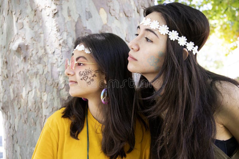 Hippie Girls with Makeup on Their Faces Looking To the Side Stock Photo ...