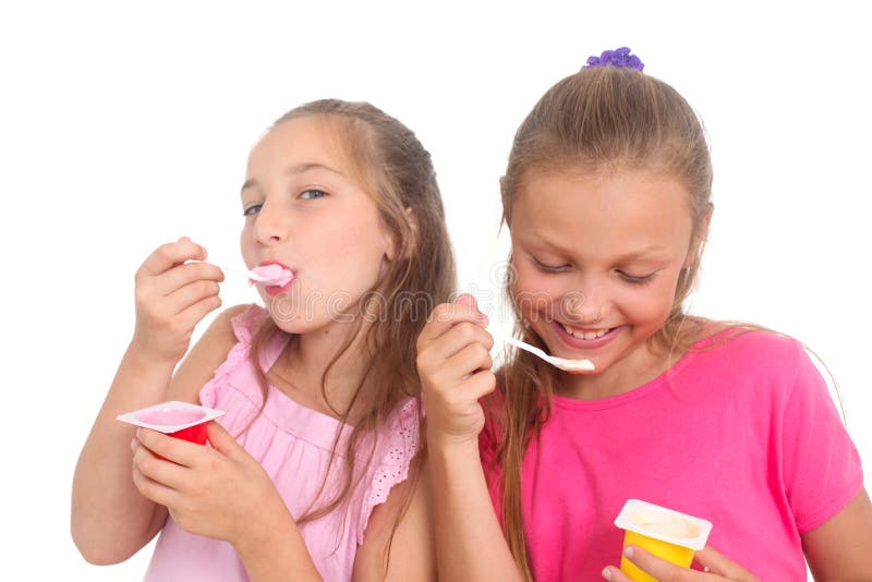 Girls eating yogurt stock photo. Image of hungry, girls - 49699854