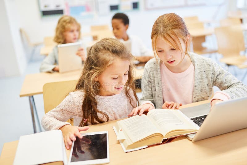 Girls in Elementary School Learn on Laptop Computer Stock Photo - Image ...