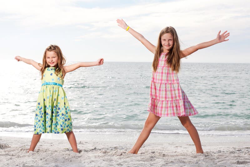 Girls Enjoy Summer Day at the Beach. Stock Image - Image of blue ...
