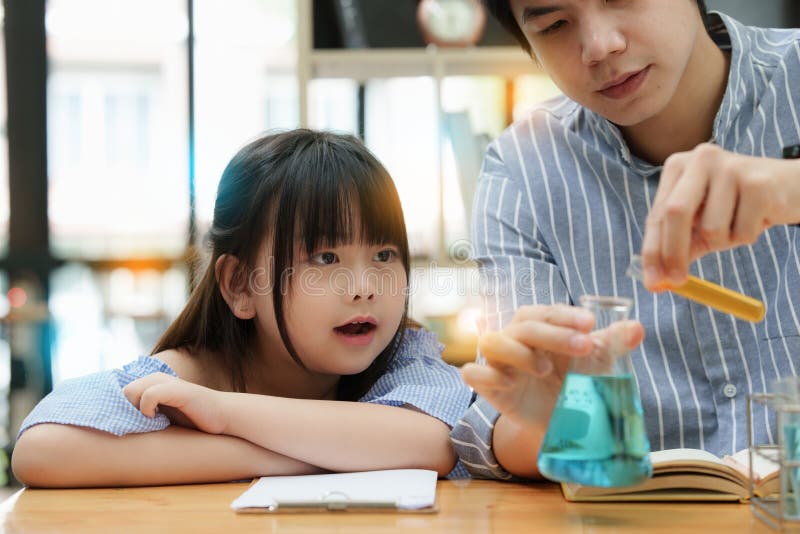 Girls and Father Doing Science Experiments. Education Science Concept ...