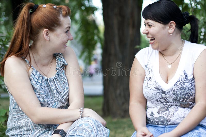 Two Pretty Adult Girls Having a Conversation Stock Photo - Image of ...