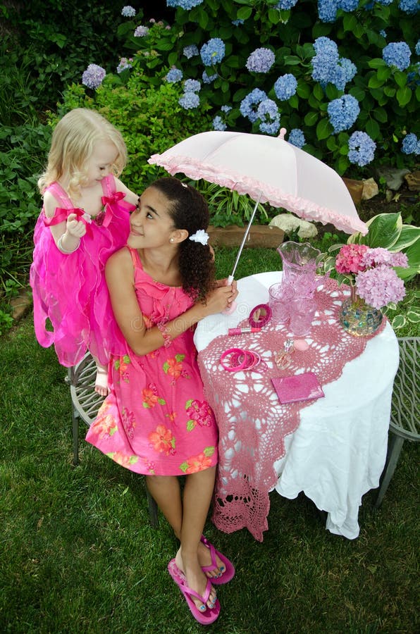 Girls having yard party stock photo. Image of blue, pink - 24904442