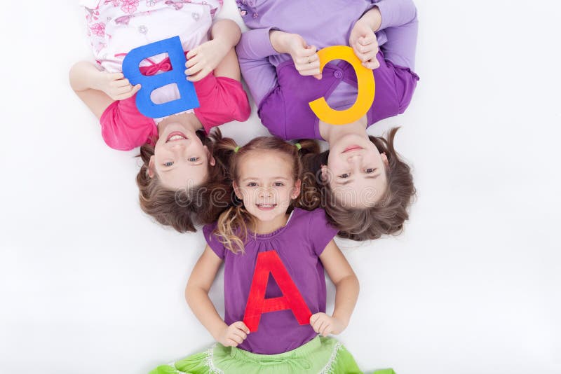 Happy Kids Holding Alphabet Letters Abc Stock Photos - Free & Royalty ...