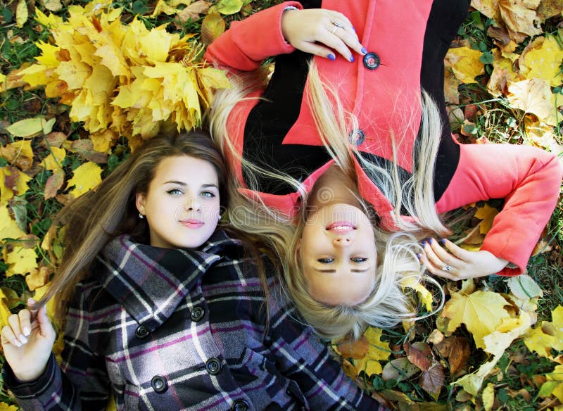 Girls lie on the grass stock image. Image of caucasian - 47362527