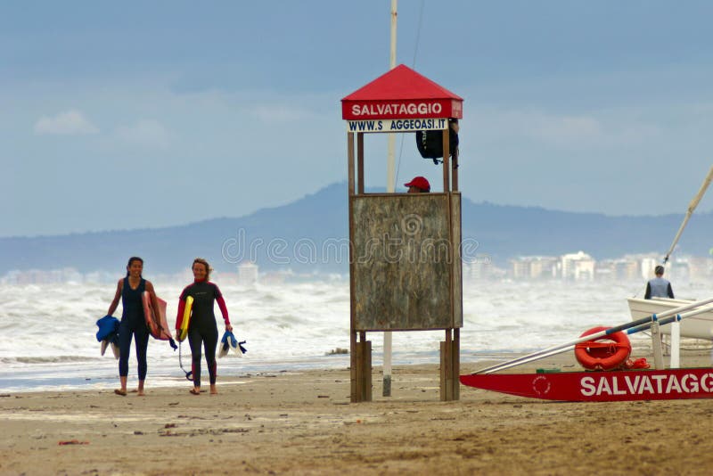 Lifeguard Girls Standing in Front of the Lake on Back View Editorial ...