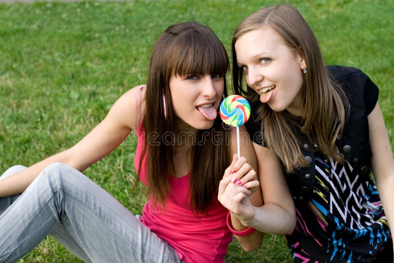 Girls with a lollipop stock image. Image of attractive - 15170571