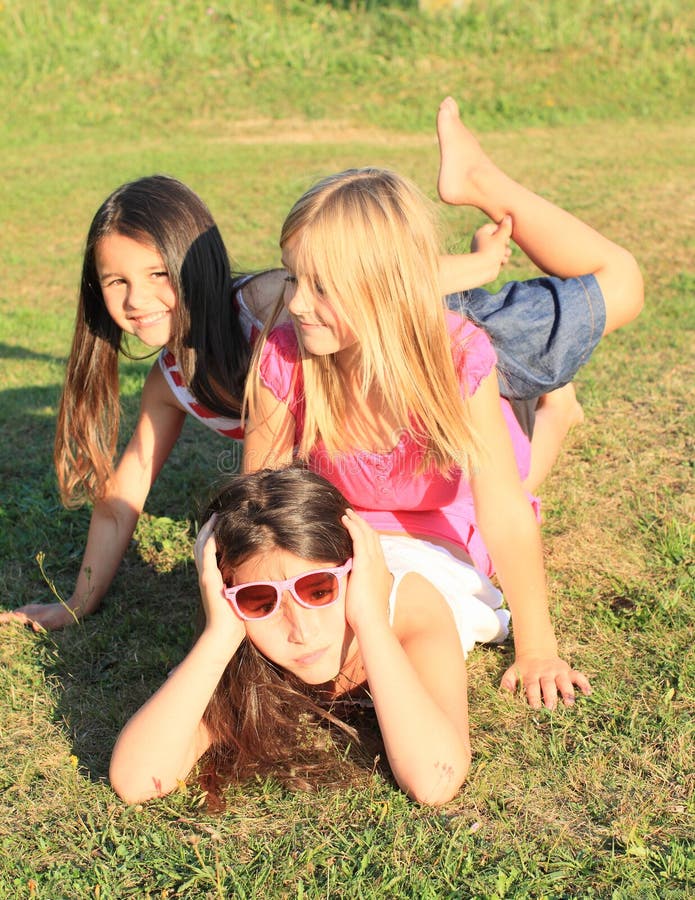 Girls lying on grass stock image. Image of child, barefooted - 33270675