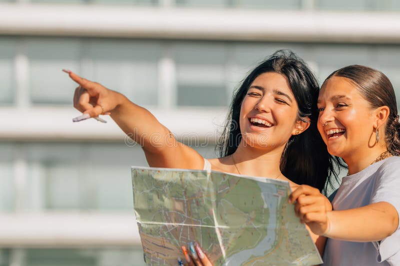 Girls with map on travel stock photo. Image of explore - 330520348