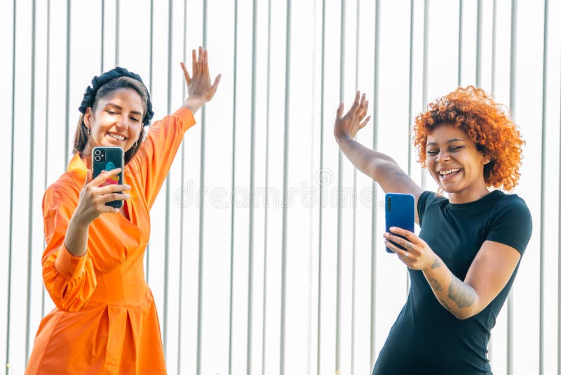 Girls with mobile phones stock image. Image of media - 226697771