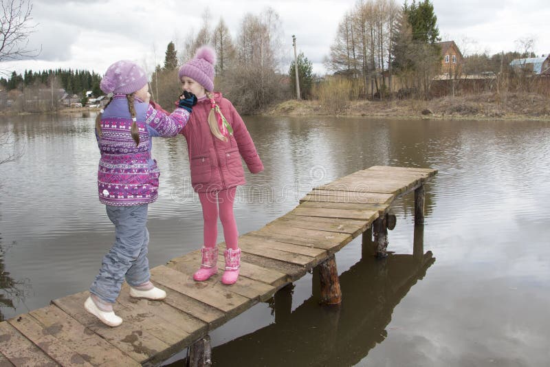 Girls near the lake stock image. Image of outdoor, beautiful - 71011951