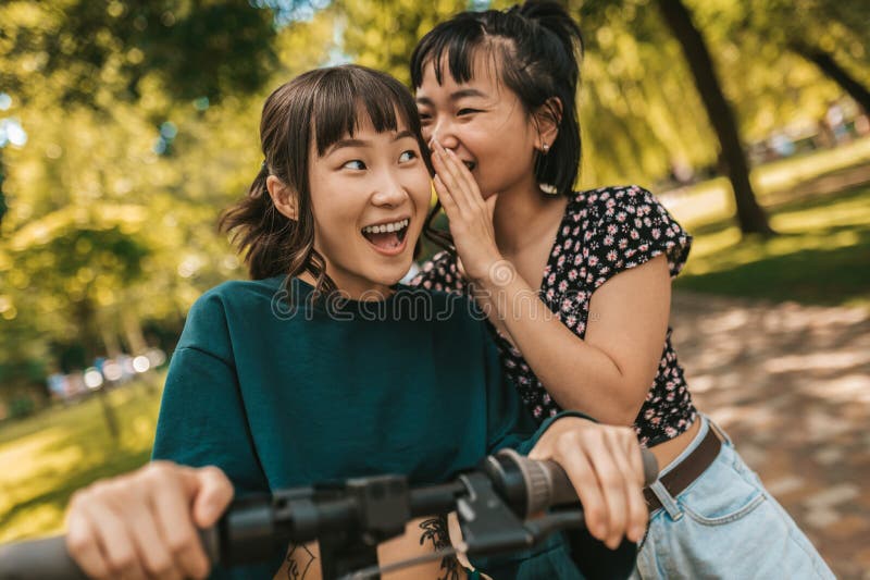 Girls in the Park Sharing Secrets and Looking Interested Stock Image ...