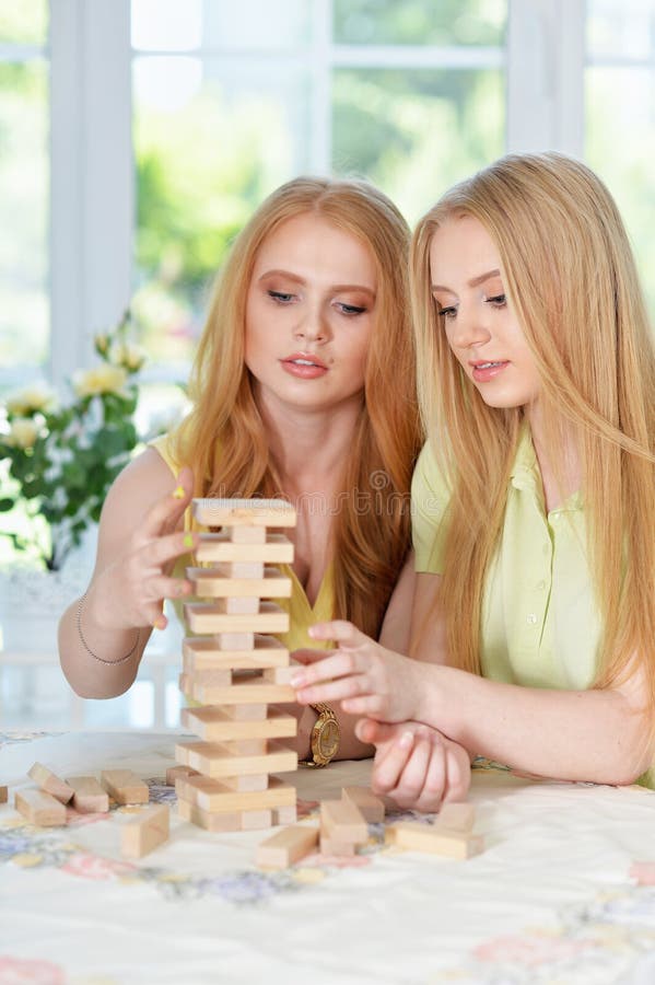 Girls playing table game stock photo. Image of pretty - 75795276