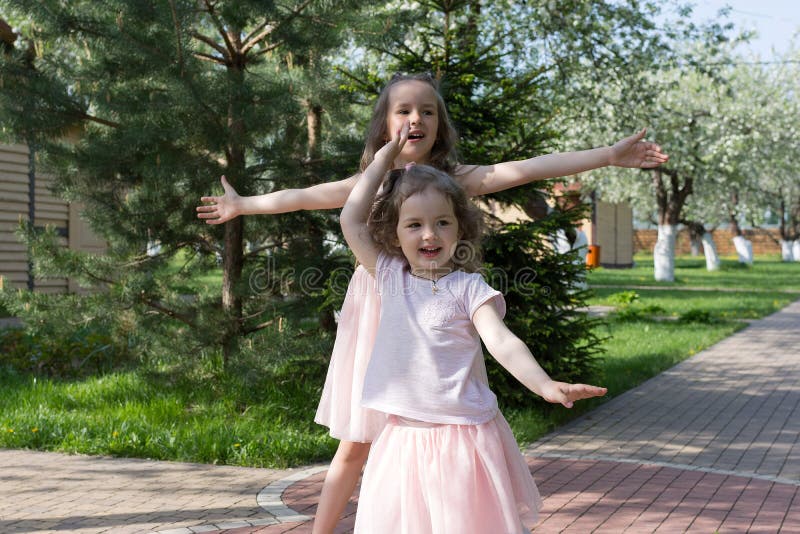Girls playing in the yard stock photo. Image of happy - 118862192