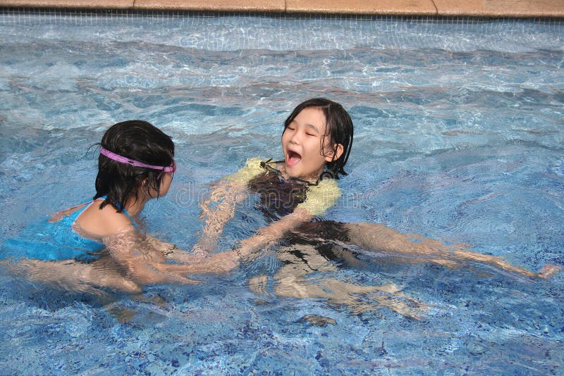 Two Girls Underwater in Swimming Pool Stock Photo - Image of portrait ...