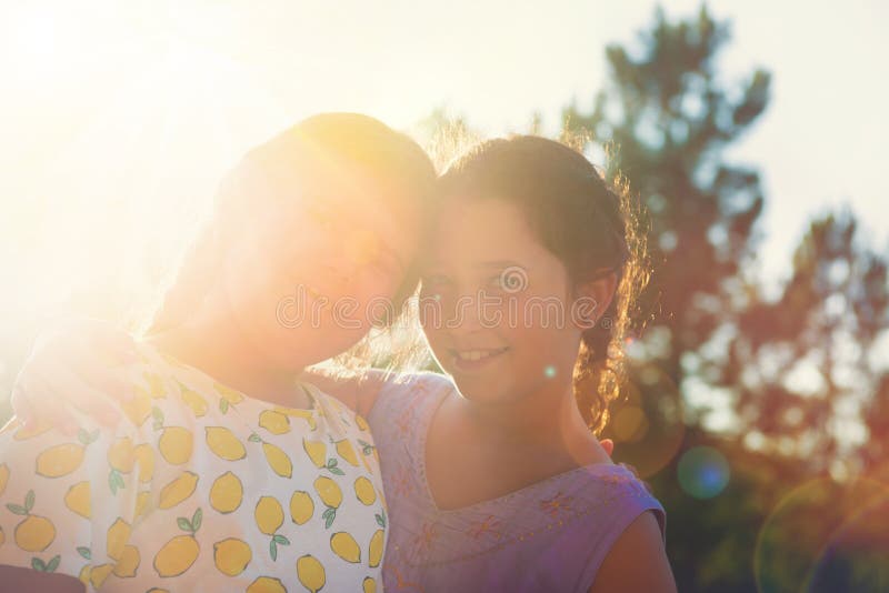 Girls posing at sunset stock image. Image of summer - 233691749