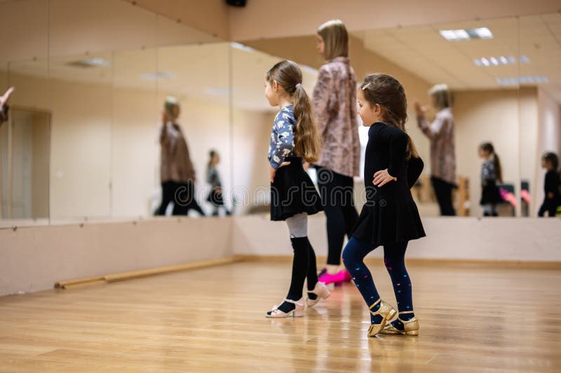 Girls Practicing Ballet in Studio with Instructor Stock Image - Image ...