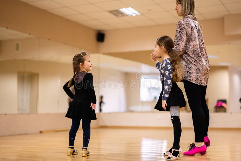 Girls Practicing Dance Moves with Instructor in Spacious Dance Studio ...