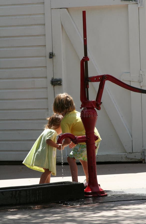 Girls at the Pump stock photo. Image of girls, children - 1056450